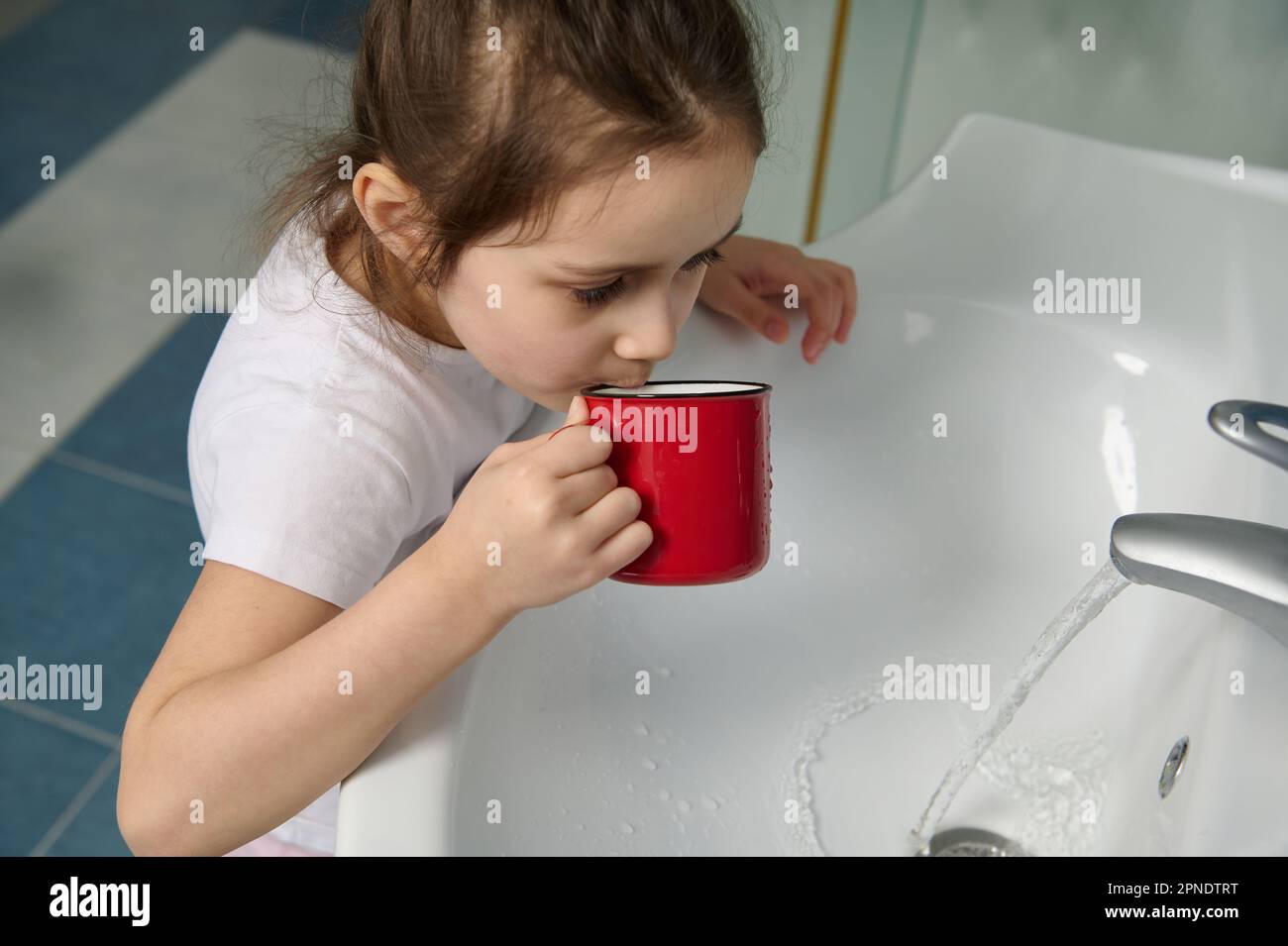 Girl rinsing toothpaste hi-res stock photography and images - Alamy