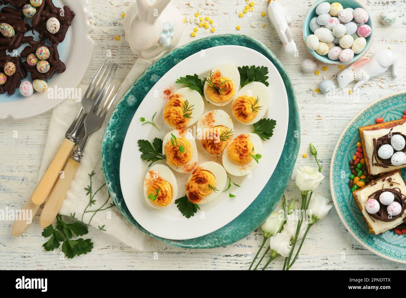 Traditional Easter brunch or dinner with stuffed eggs with paprika ...