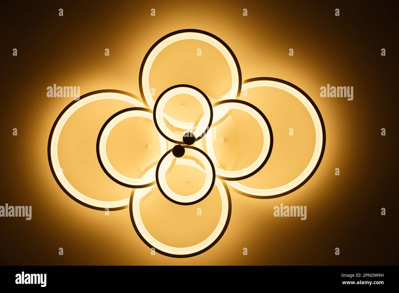 Luminous modern LED ring lamp on the ceiling. Bottom view Stock Photo ...