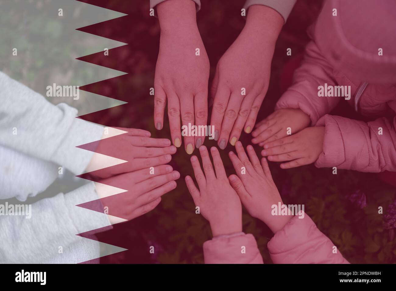 Hands of kids on background of Qatar flag. Qatari patriotism and unity ...