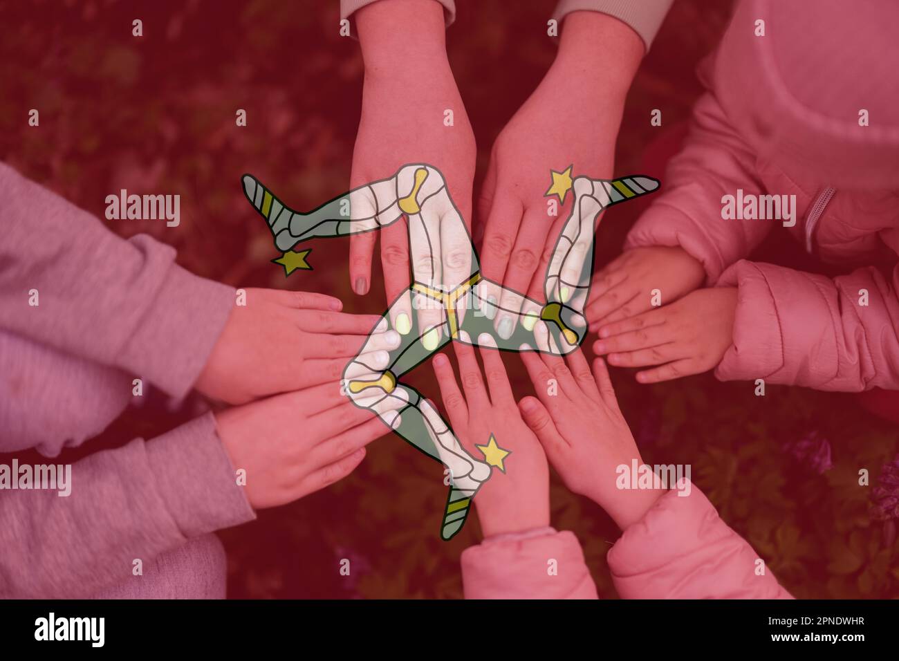 Hands of kids on background of Isle of Man flag. Manx patriotism and ...