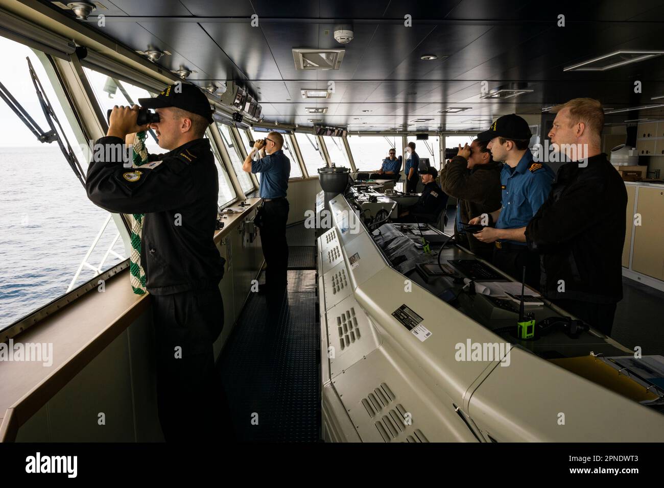 Crew standing watch on the bridge of HMCS Margaret Brooke during ...
