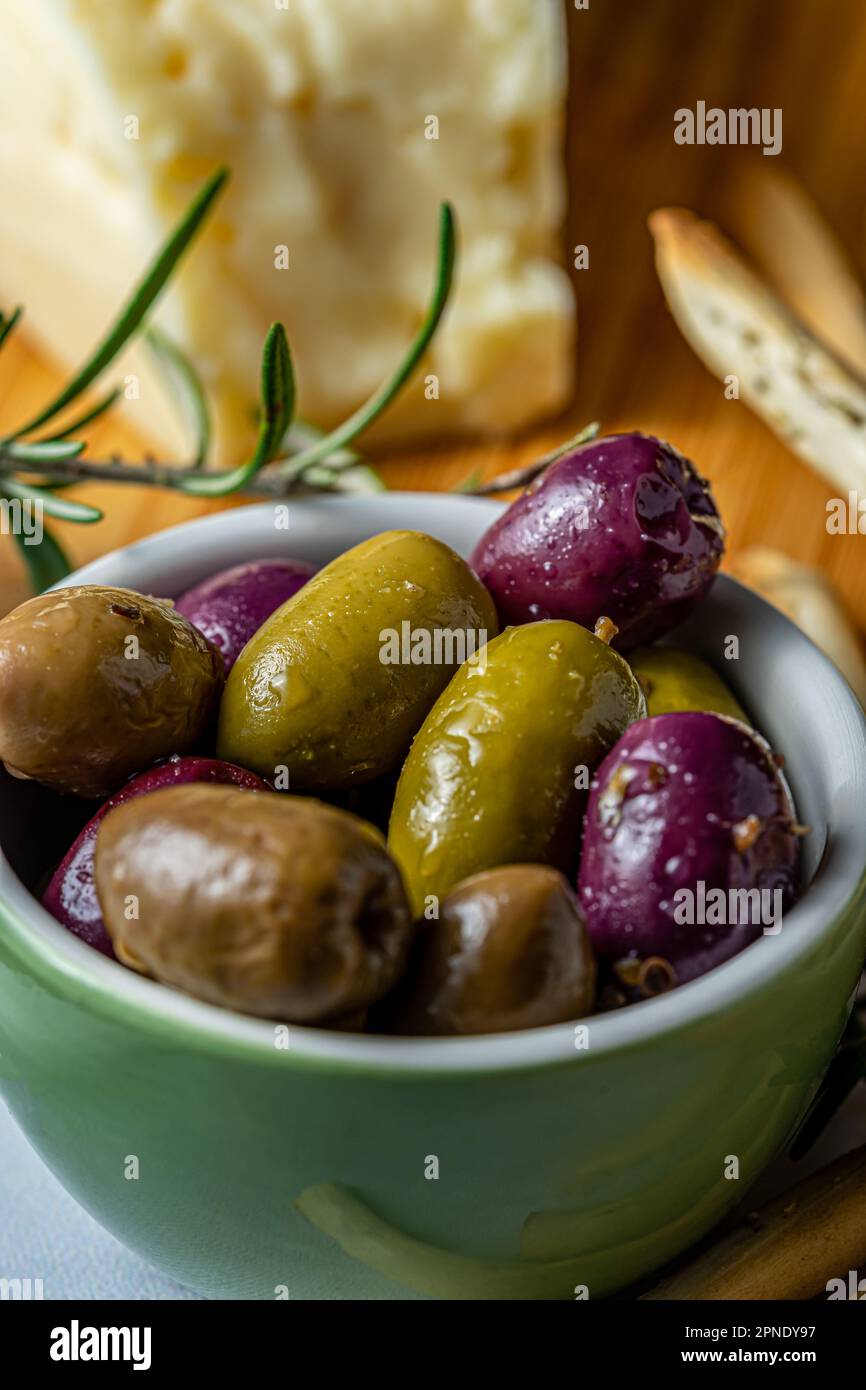 Mixed Greek olives in a serving dish. Above, close up shot Stock Photo ...