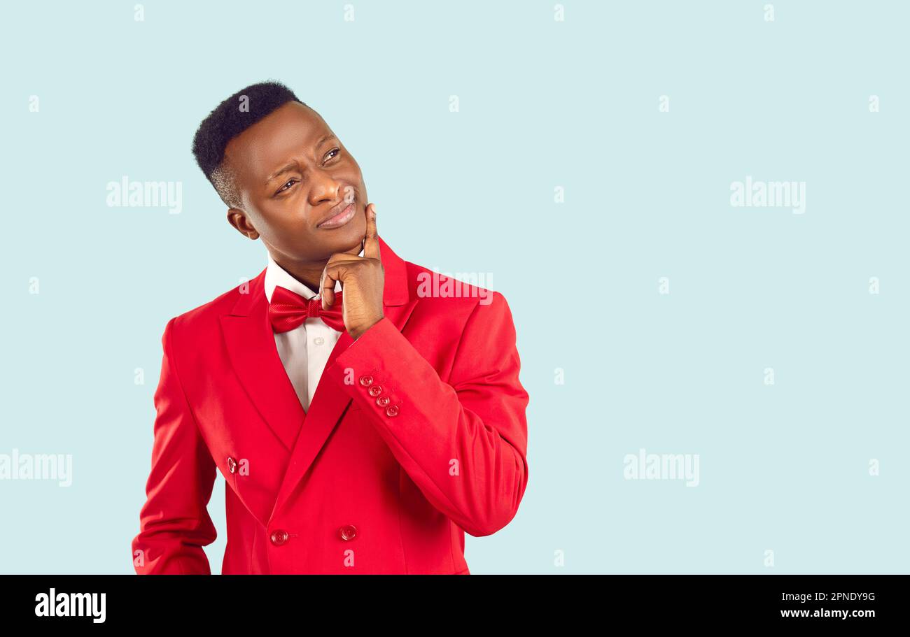 Elegant man feels doubt and embarrassment because of different options ...