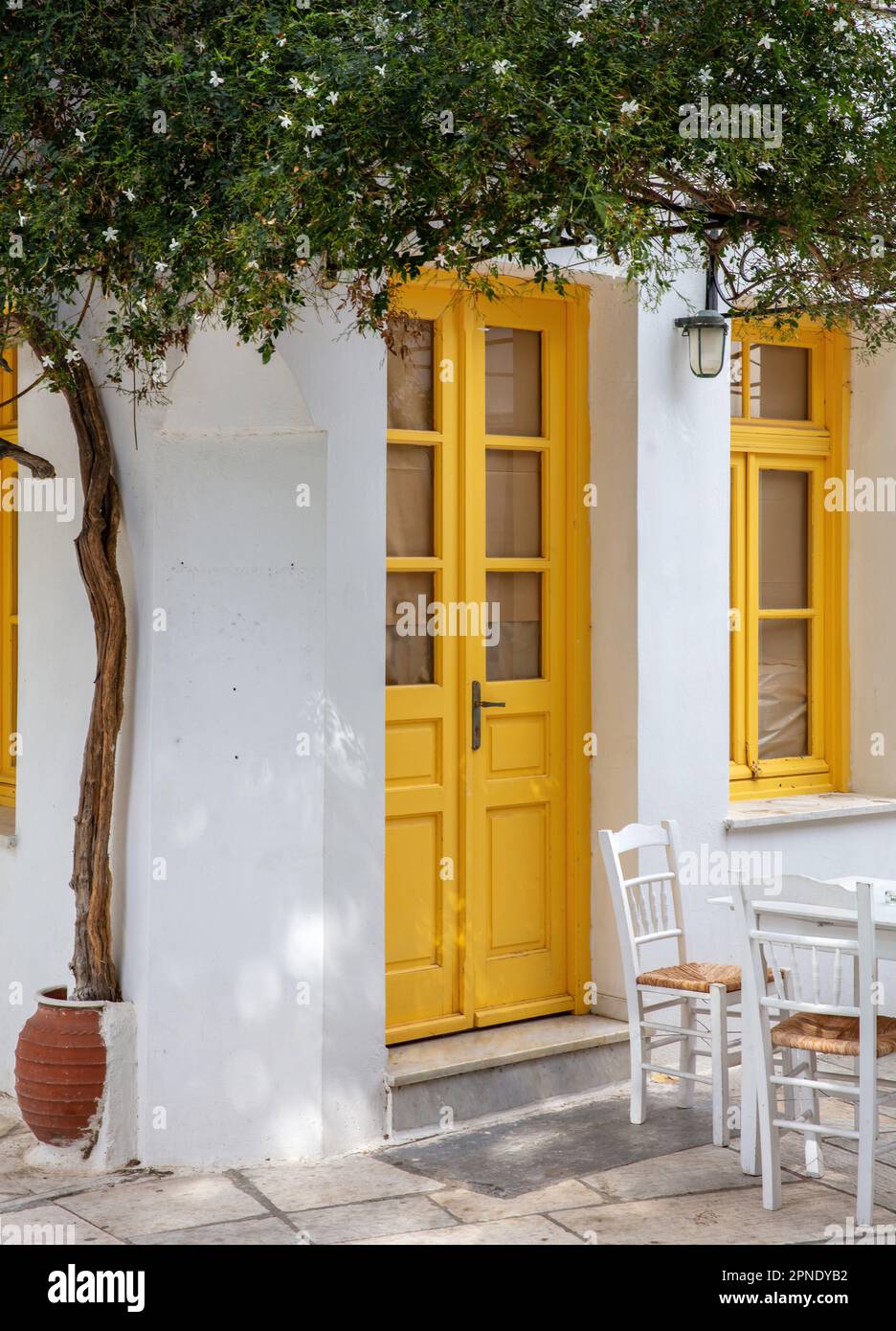 Greece. Tinos island of art, Yellow color home entrance door on white ...