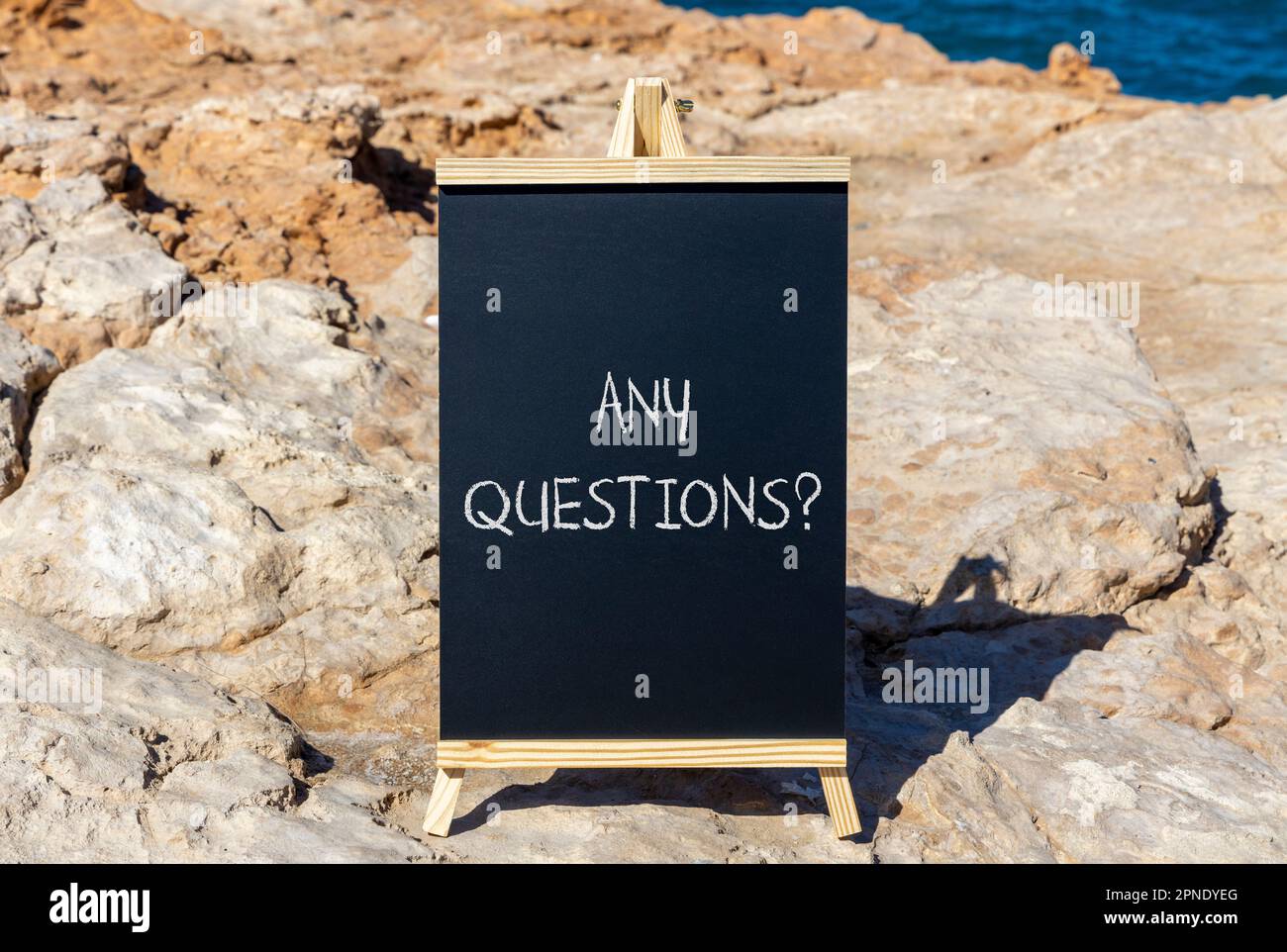 Any questions symbol. Concept words Any questions on black chalk ...