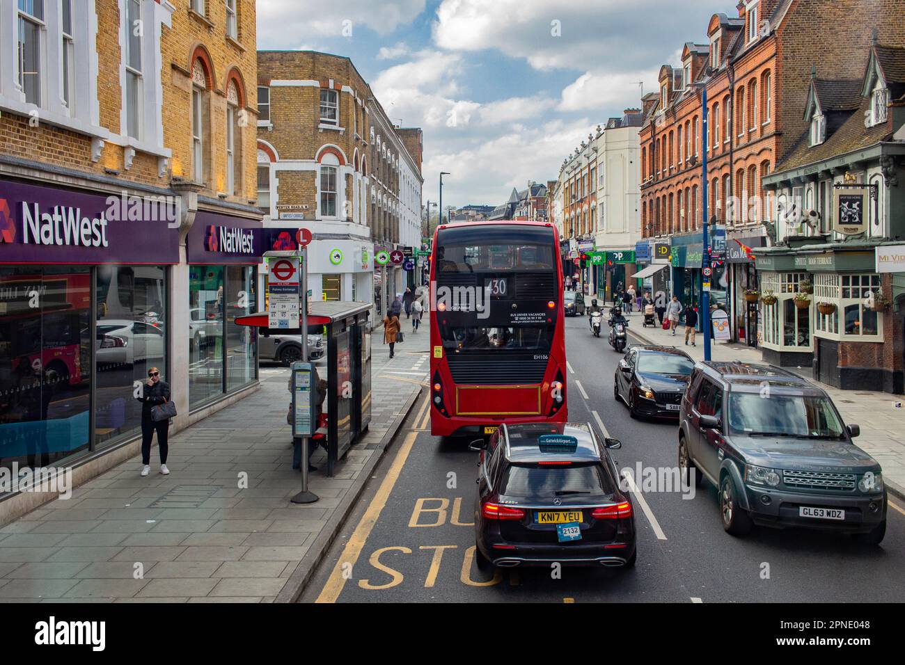 Putney High St, Putney, London; typical British shopping street, busy ...