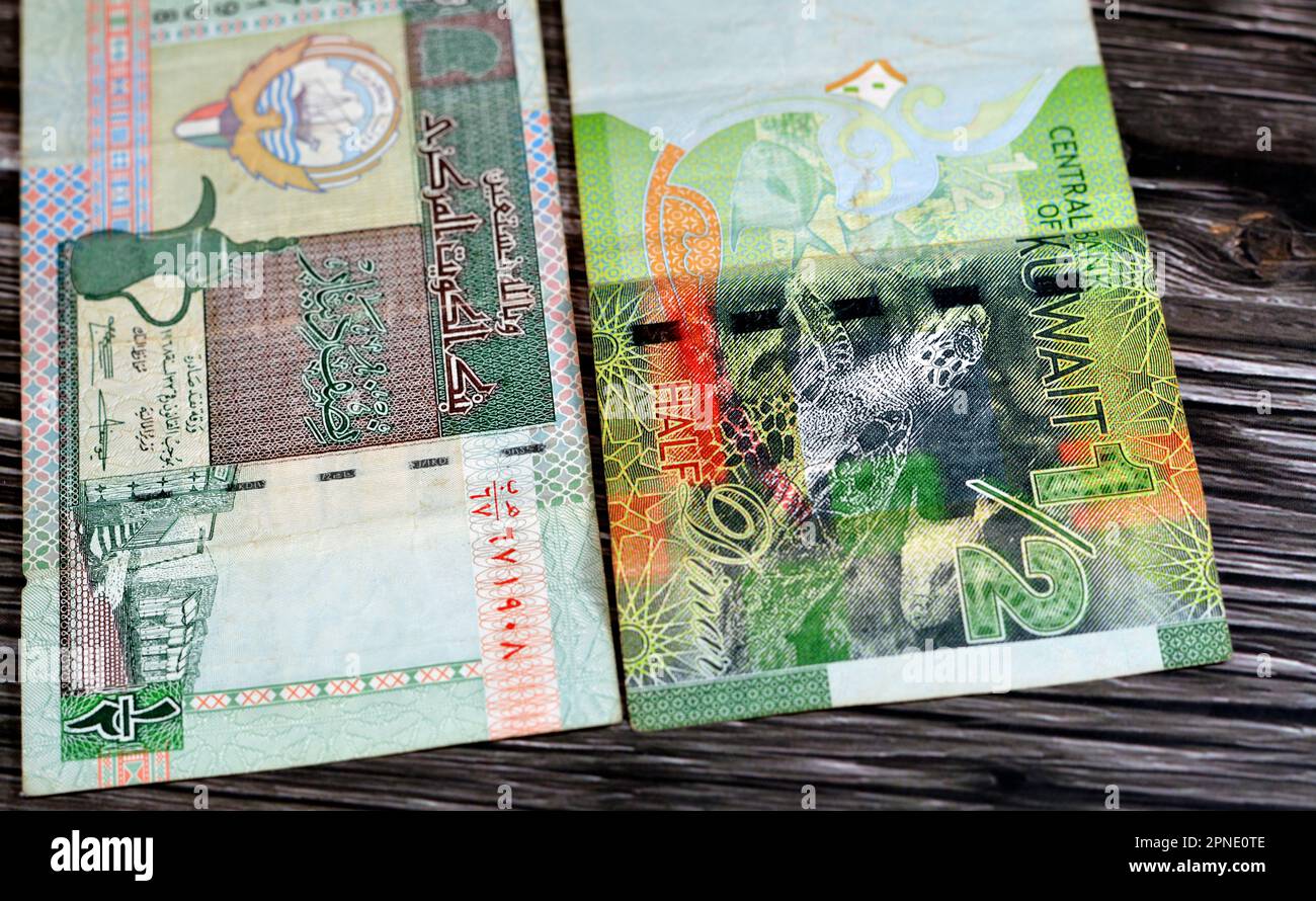Old and new Kuwaiti half dinar bill banknotes money coat of arms of ...