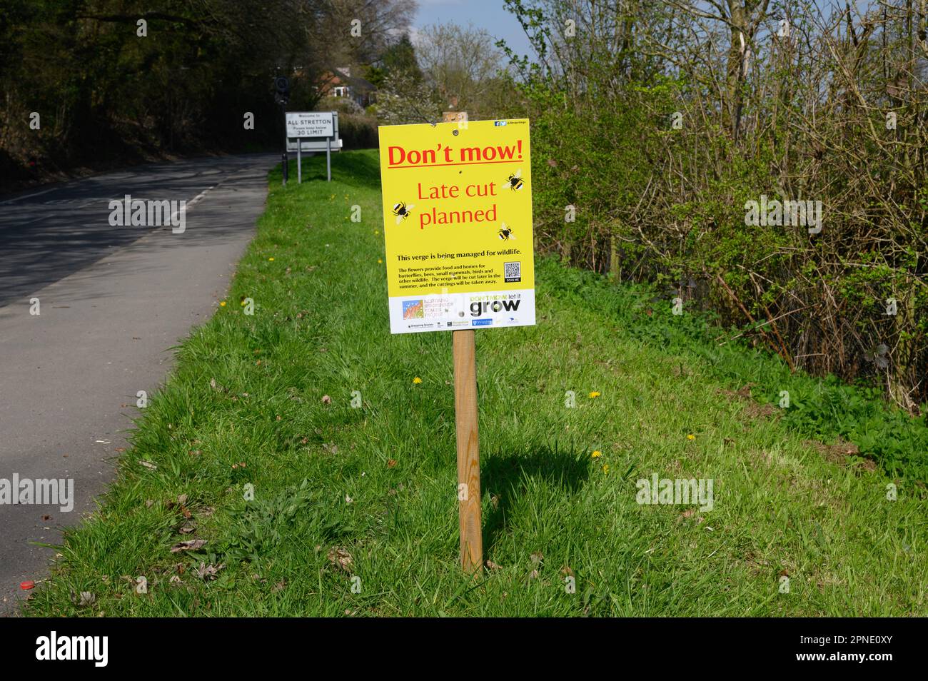 Late cut planned sign on a roadside grass verge in an effort to provide ...