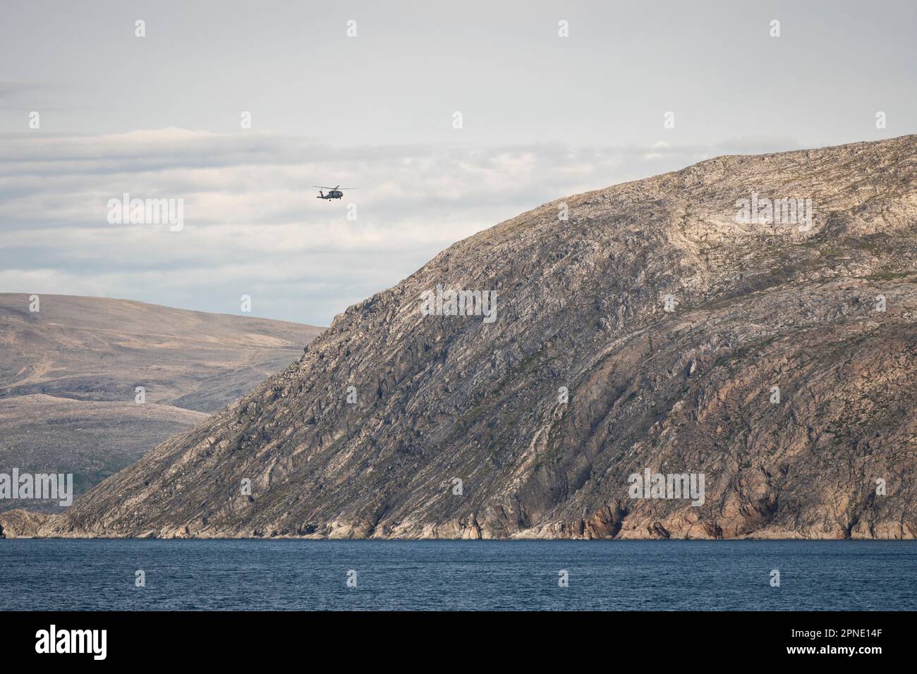 Royal Danish Navy MH-60R Seahawk helicopter flying from patrol ship ...