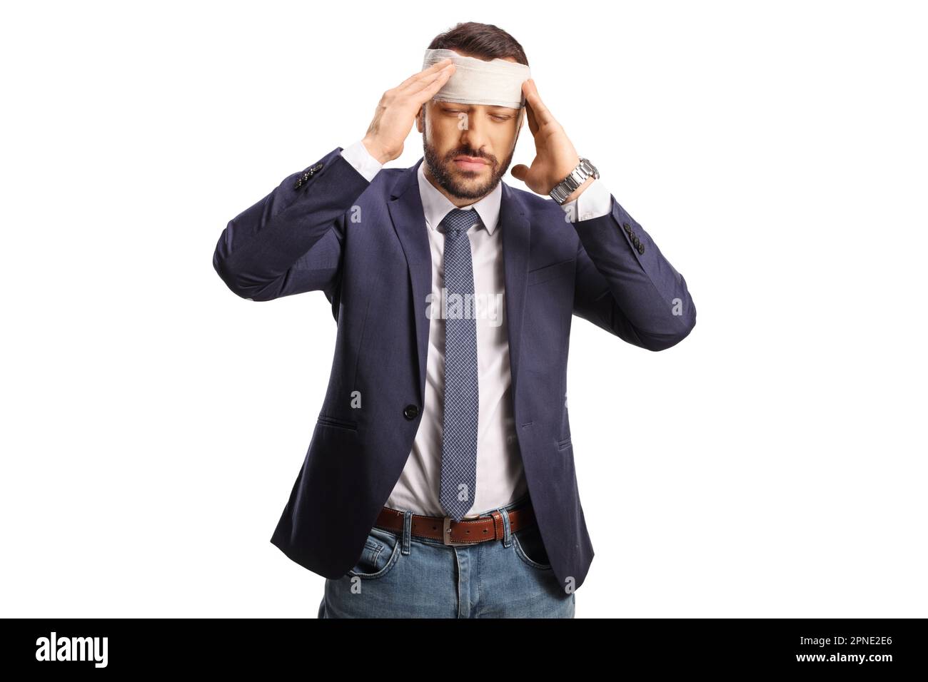 Man with a head injury wearing bandage and holding head isolated on ...