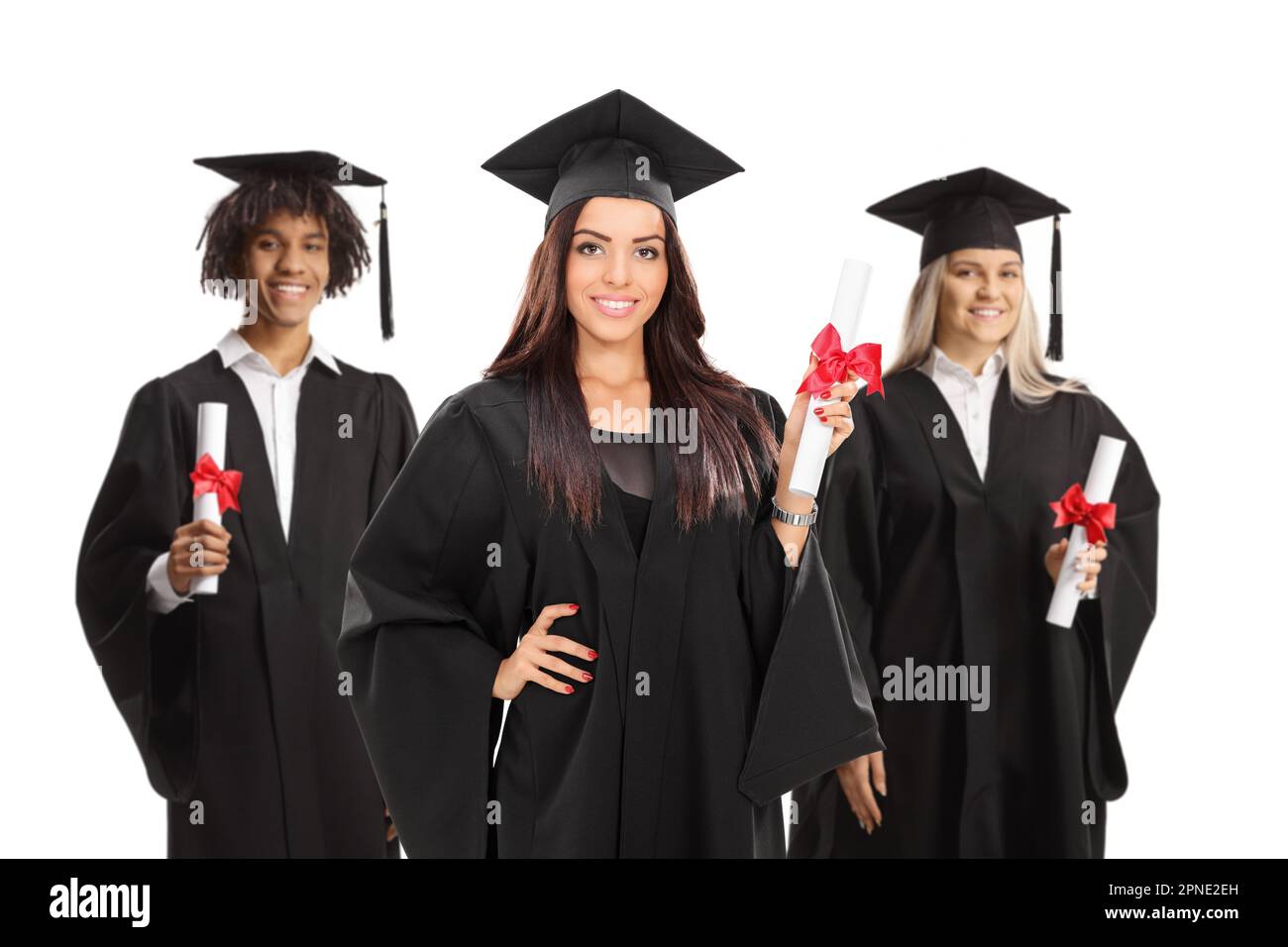 Group of male and female graduate students in gowns holding diplomas ...
