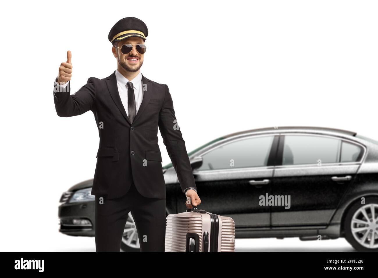Chauffeur carrying a suitcase and gesturing a thumb up sign isolated on ...