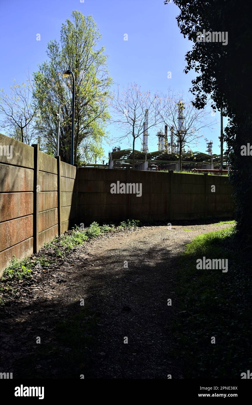 Corner in a concrete boundary wall of an industrial complex in a forest ...