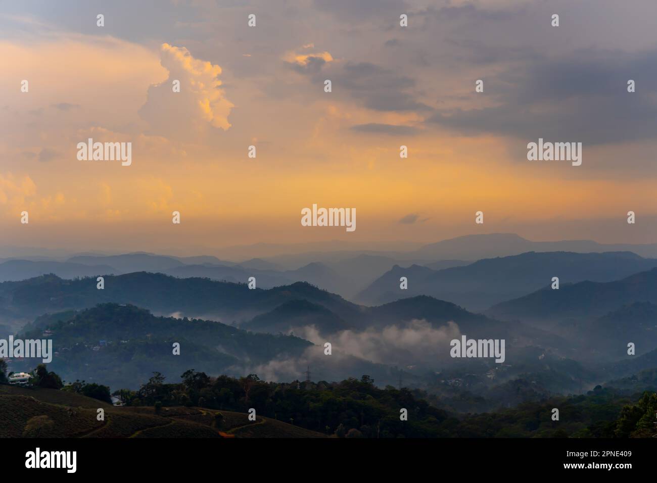Mountain range visible in Munnar, Kerala, India. During Sun set time ...