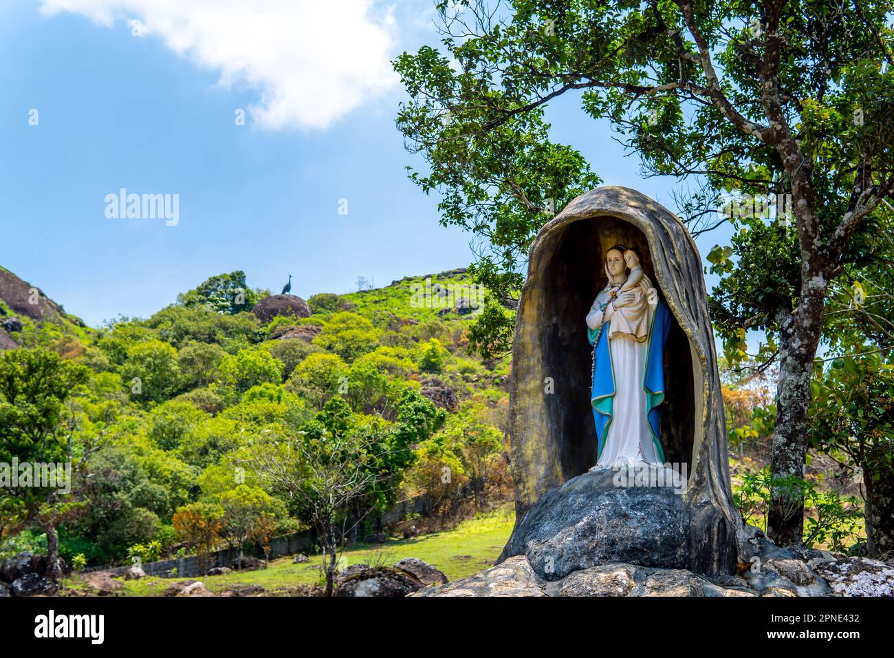 Mother Mary statue with a beautiful mountain the background Stock Photo ...