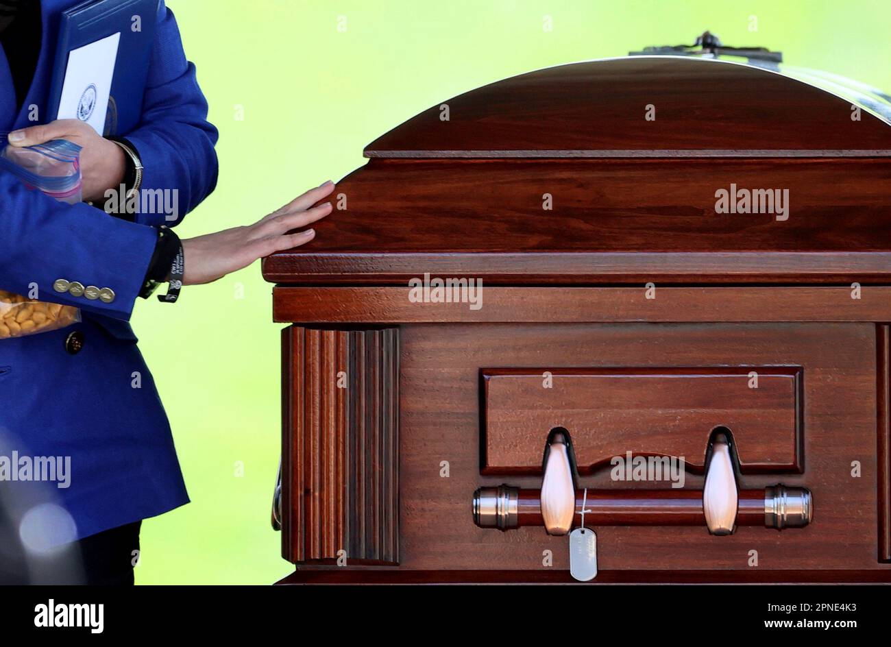 Carmen Esparza touches the casket of her brother U.S. Army Chief ...