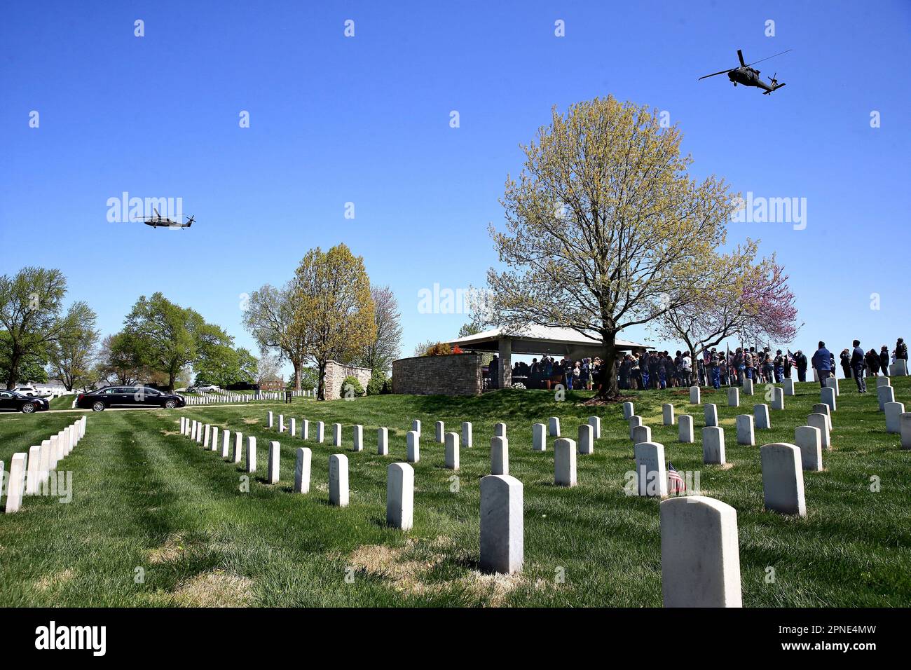 U.S. Army Black Hawk helicopters perform a flyover after as Taps was ...