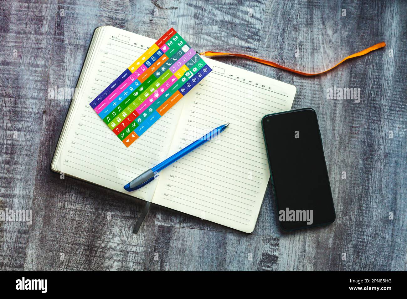 Dairy on the table with phone pen stickers in grey tone Stock Photo - Alamy