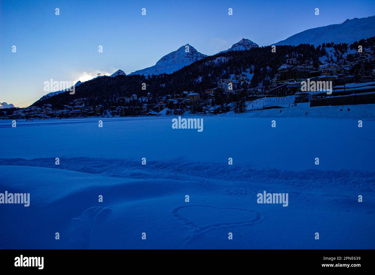Magnificent sunset in the snowy Swiss Alps overlooking the city of St ...
