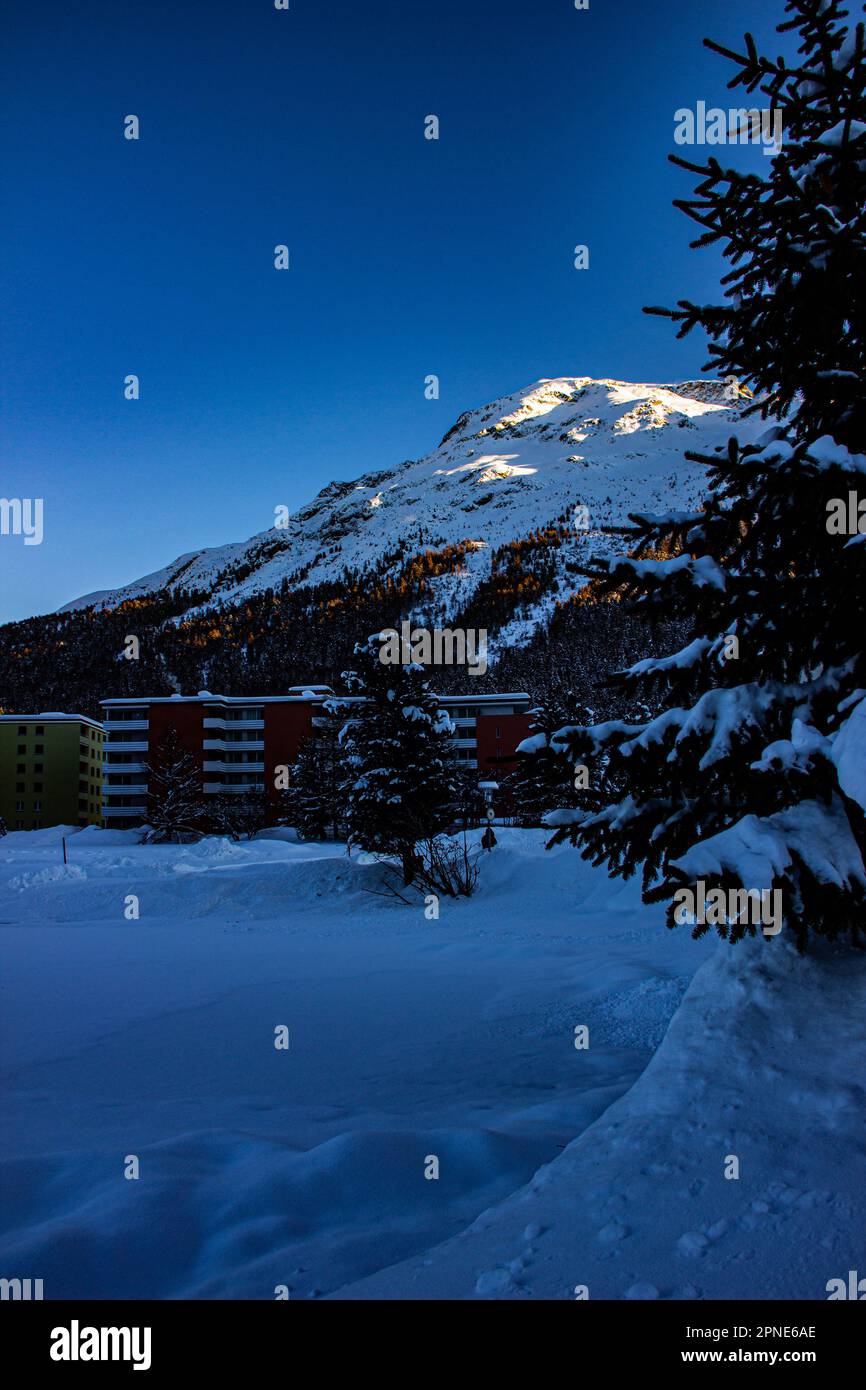 Magnificent sunset in the snowy Swiss Alps overlooking the city of St ...