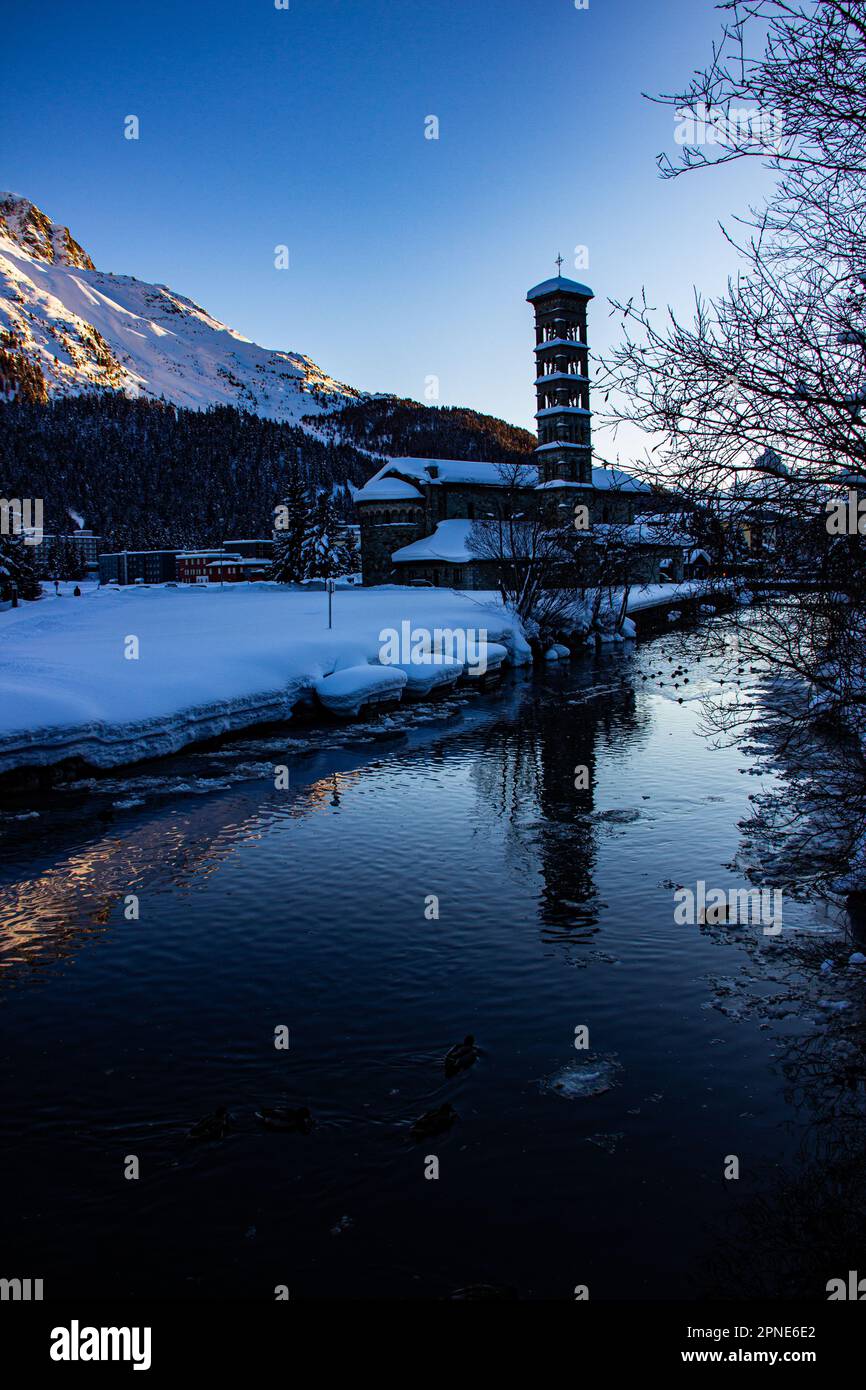 Magnificent sunset in the snowy Swiss Alps overlooking the city of St ...