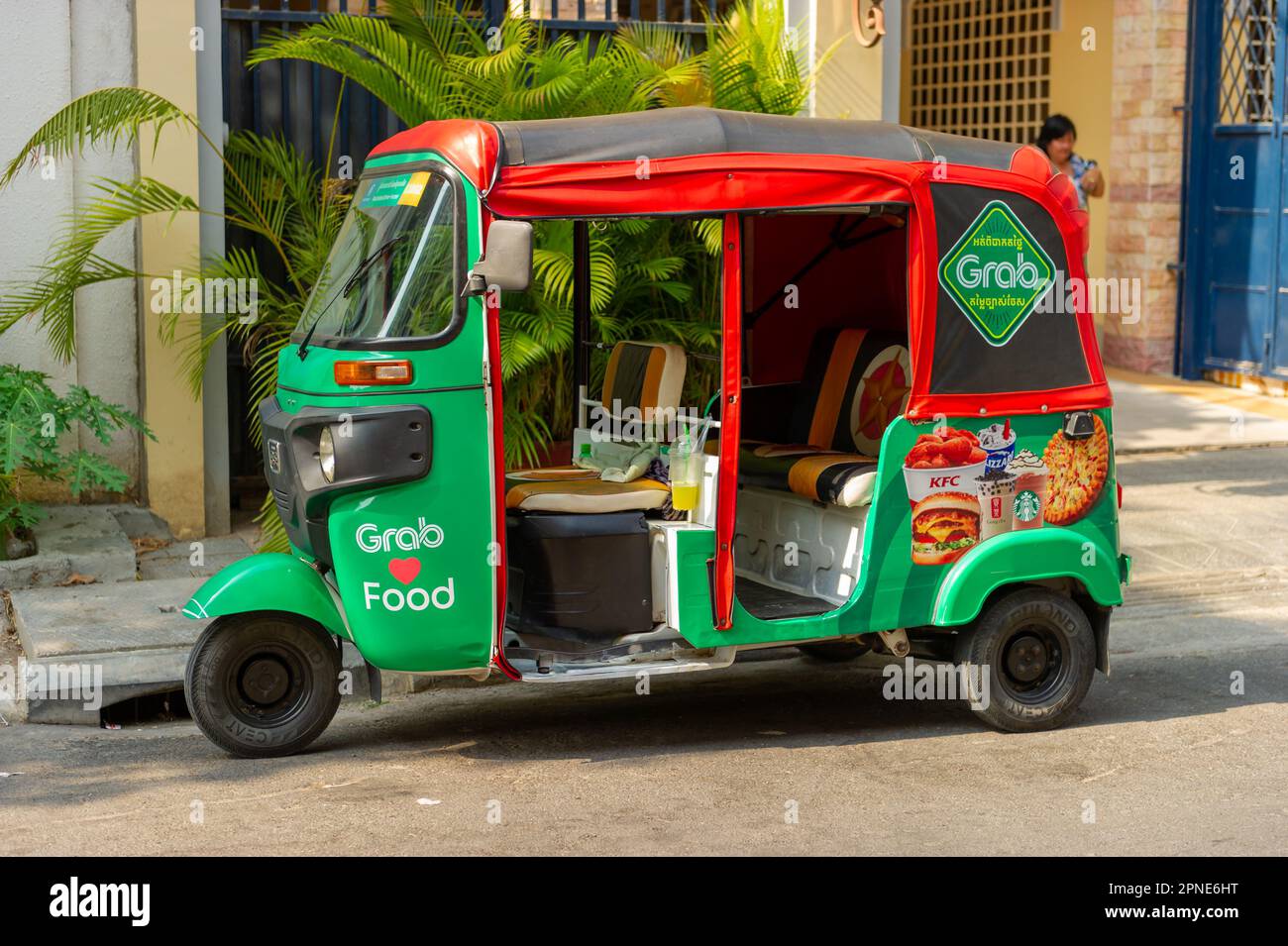 A parked Grab Tuc Tuc in Phnom Penh, Cambodia Stock Photo - Alamy