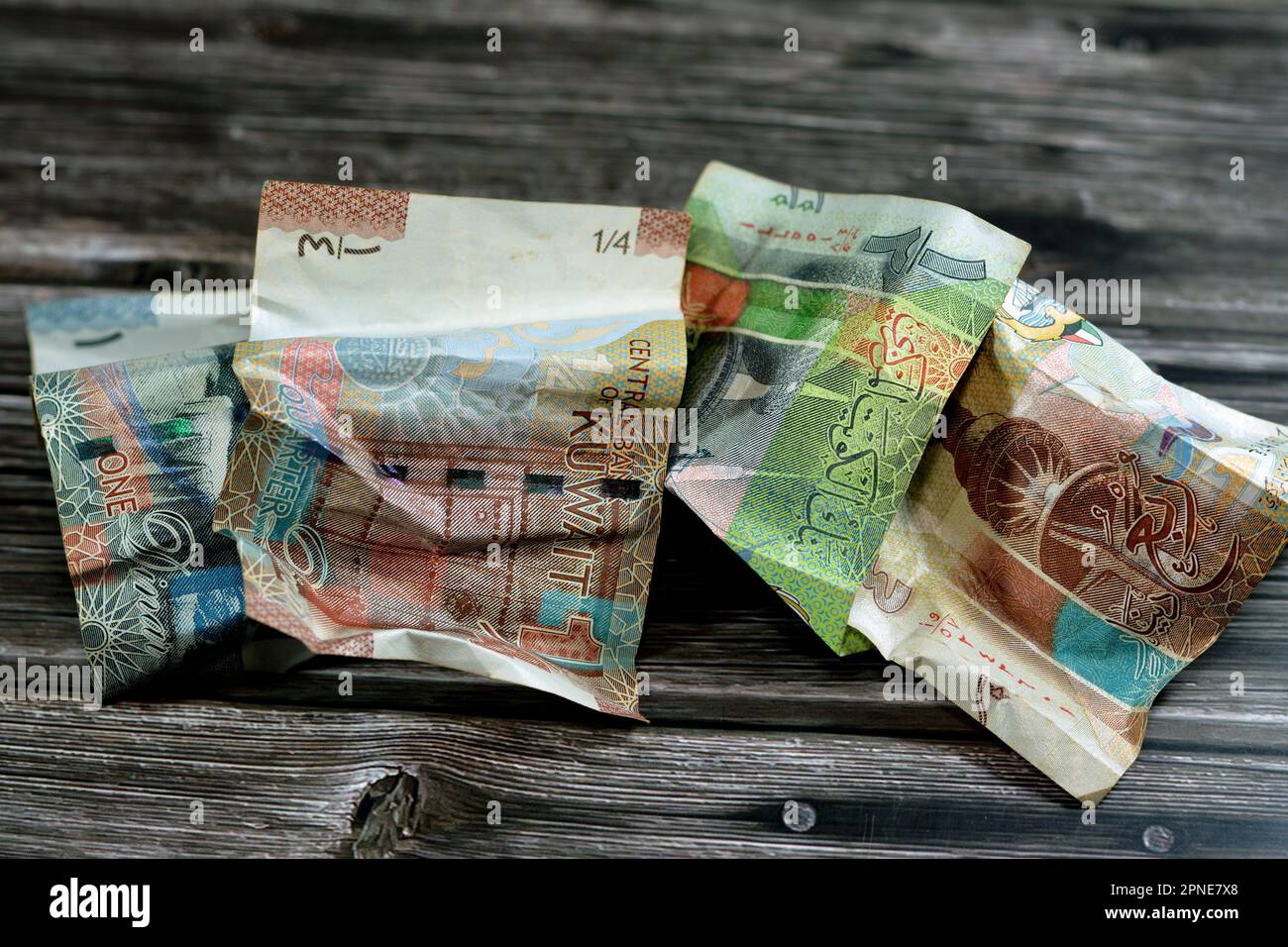 crumpled Kuwaiti money of quarter, half and one KWD Kuwait dinar bills ...