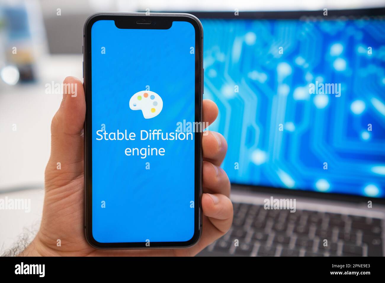 A man is holding a smartphone with a Stable Diffusion engine logo on the screen, while in the ...