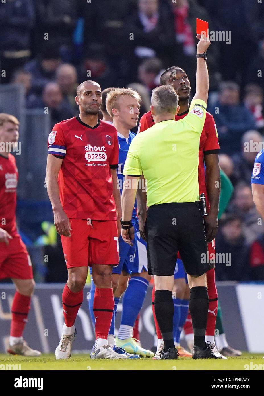Referee Carl Brook shows a red card to Leyton Orient's Omar Beckles ...