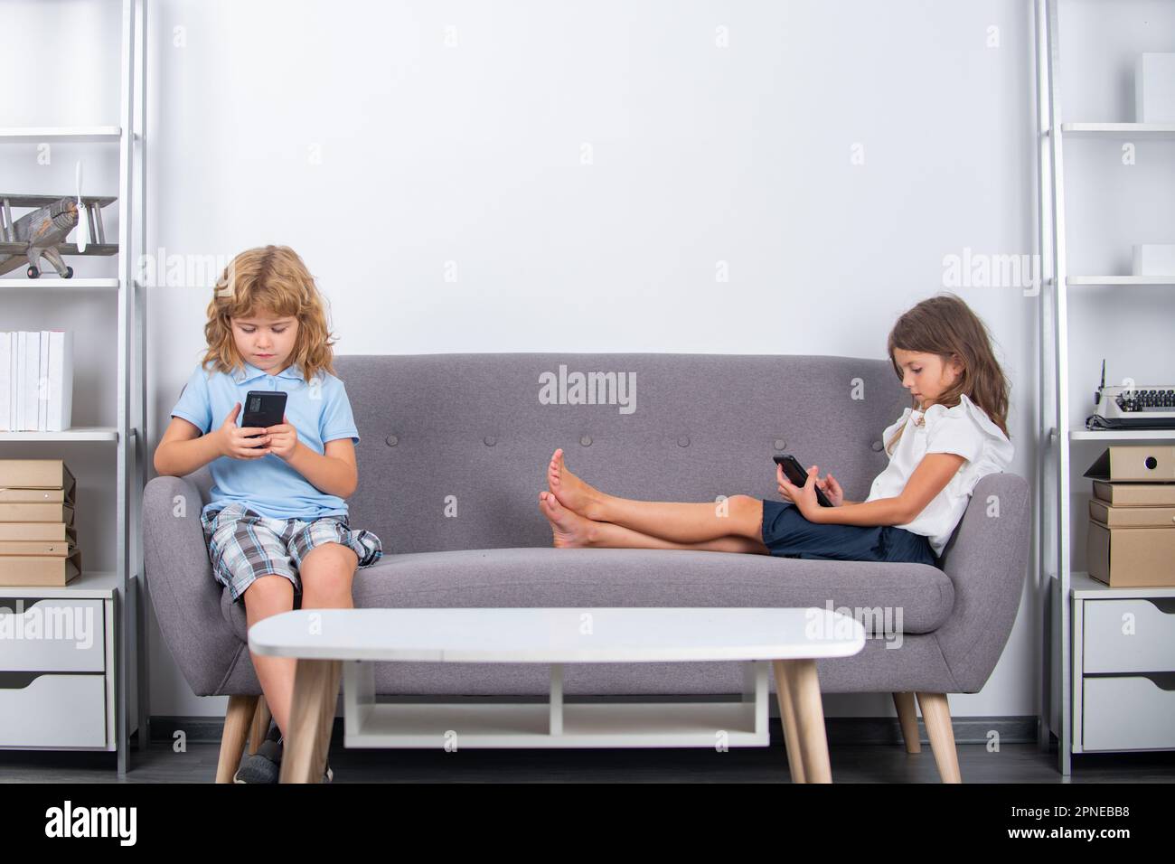 Kid with smartphone at home. Two cute children using online app on ...