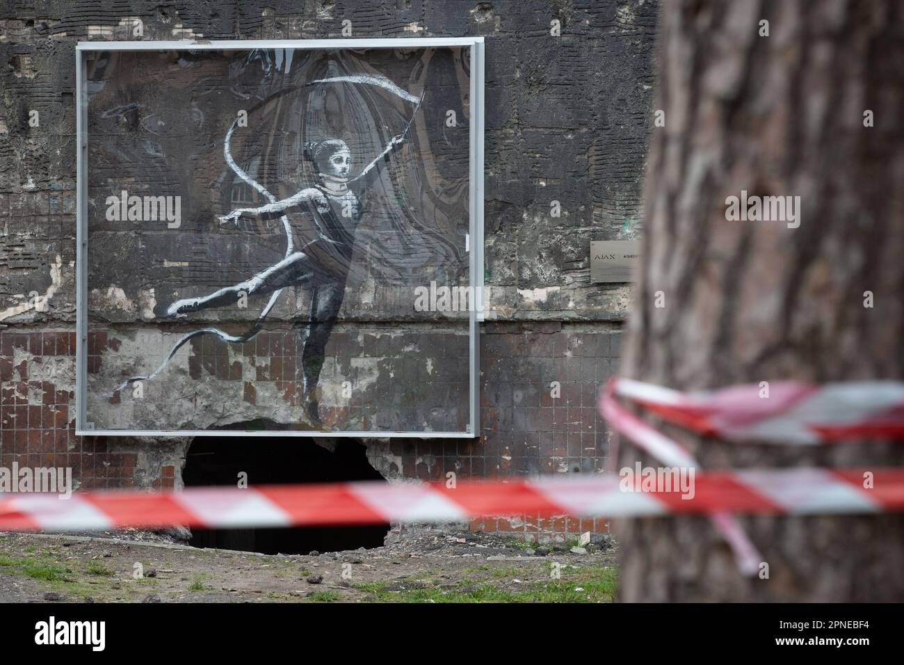 Graffiti by Banksy street artist is seen on the wall of a damaged ...