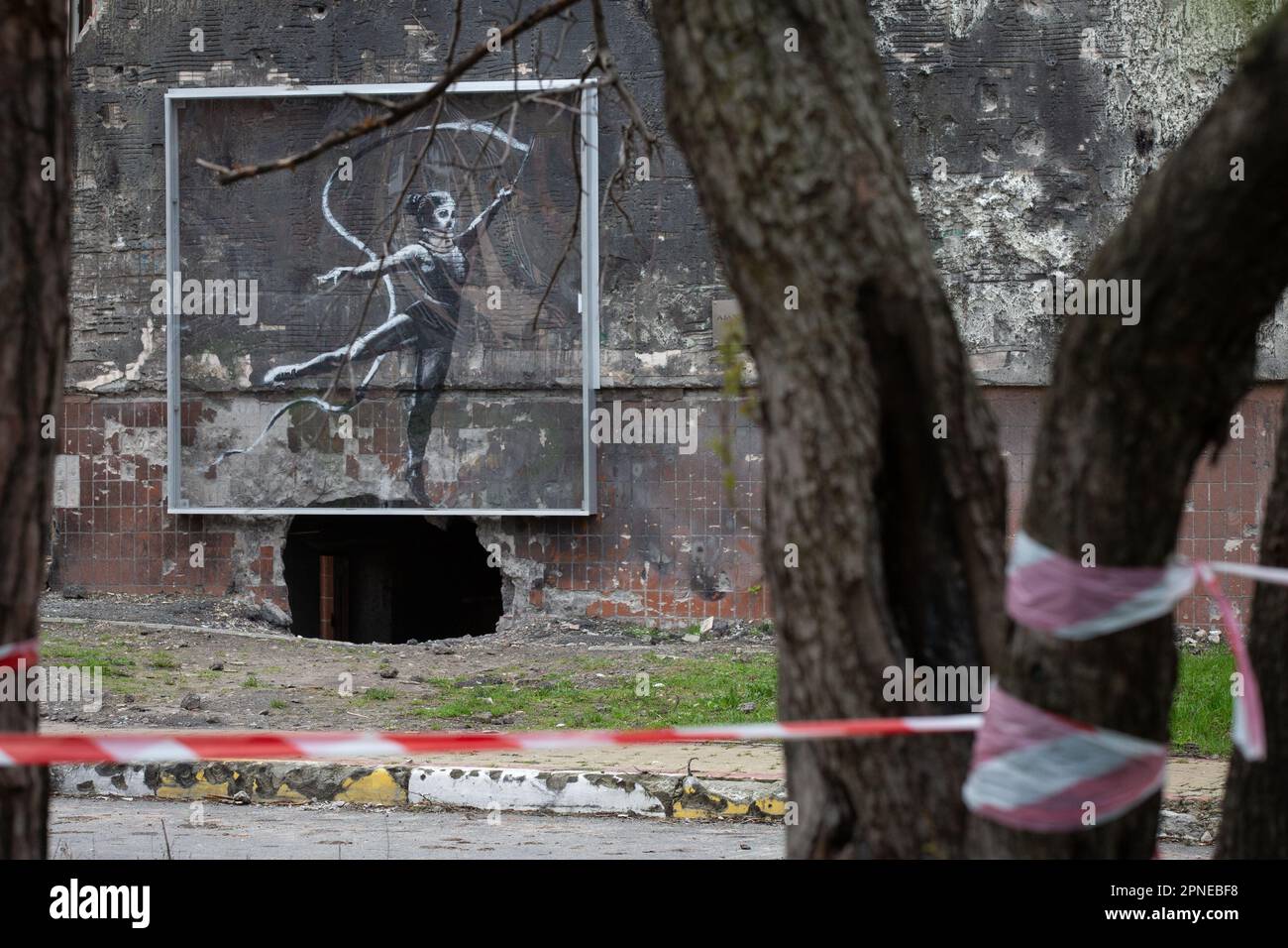 Graffiti by Banksy street artist is seen on the wall of a damaged ...