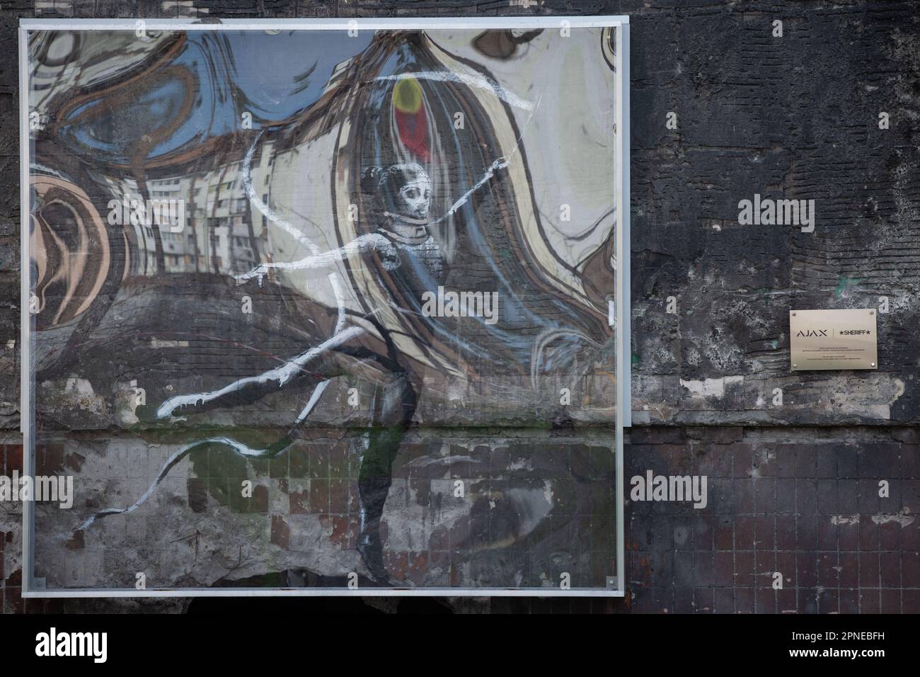 Graffiti by Banksy street artist is seen on the wall of a damaged ...