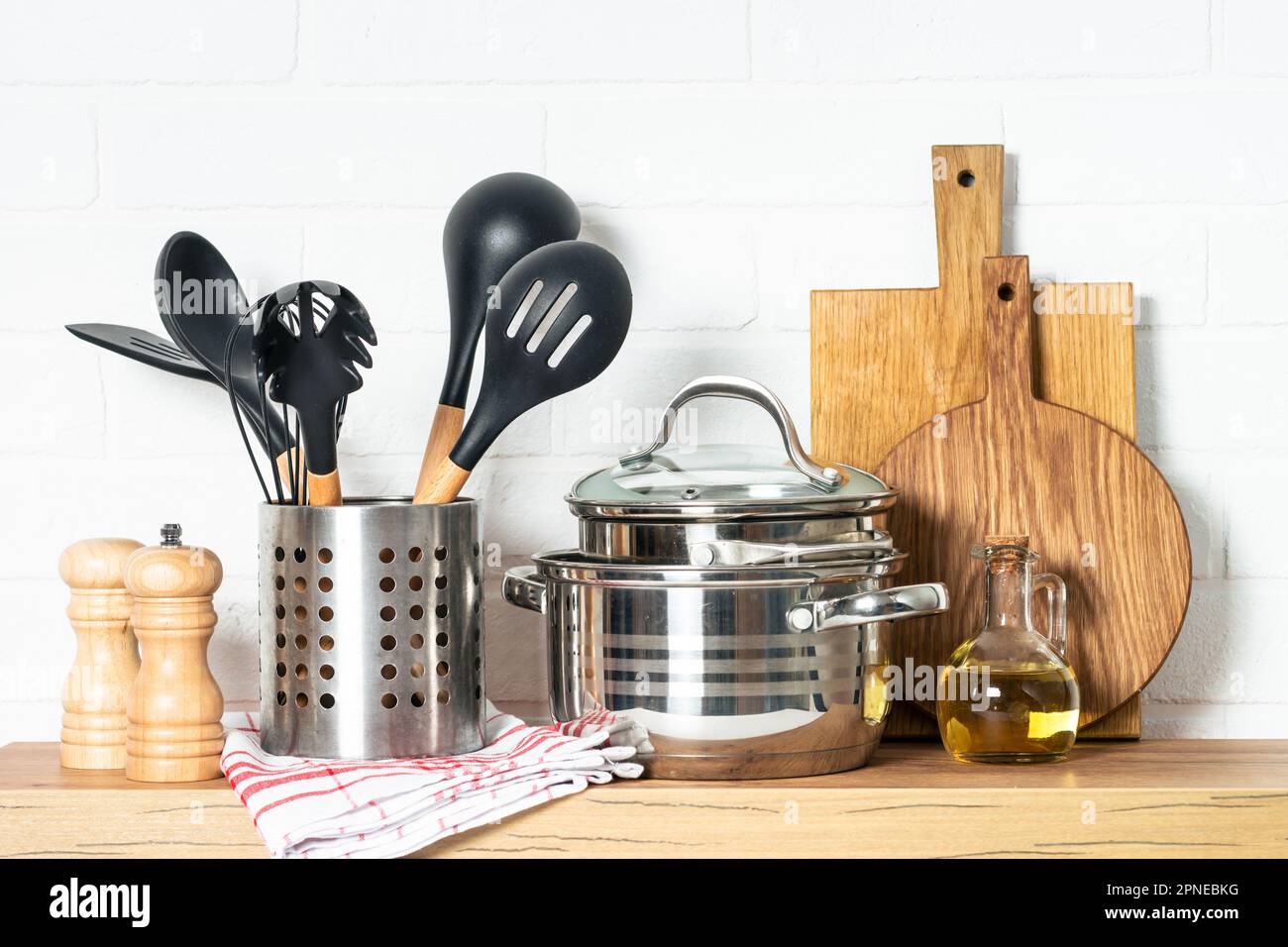 Kitchen table, kitchen utensils, cooking pots at white kitchen Stock ...