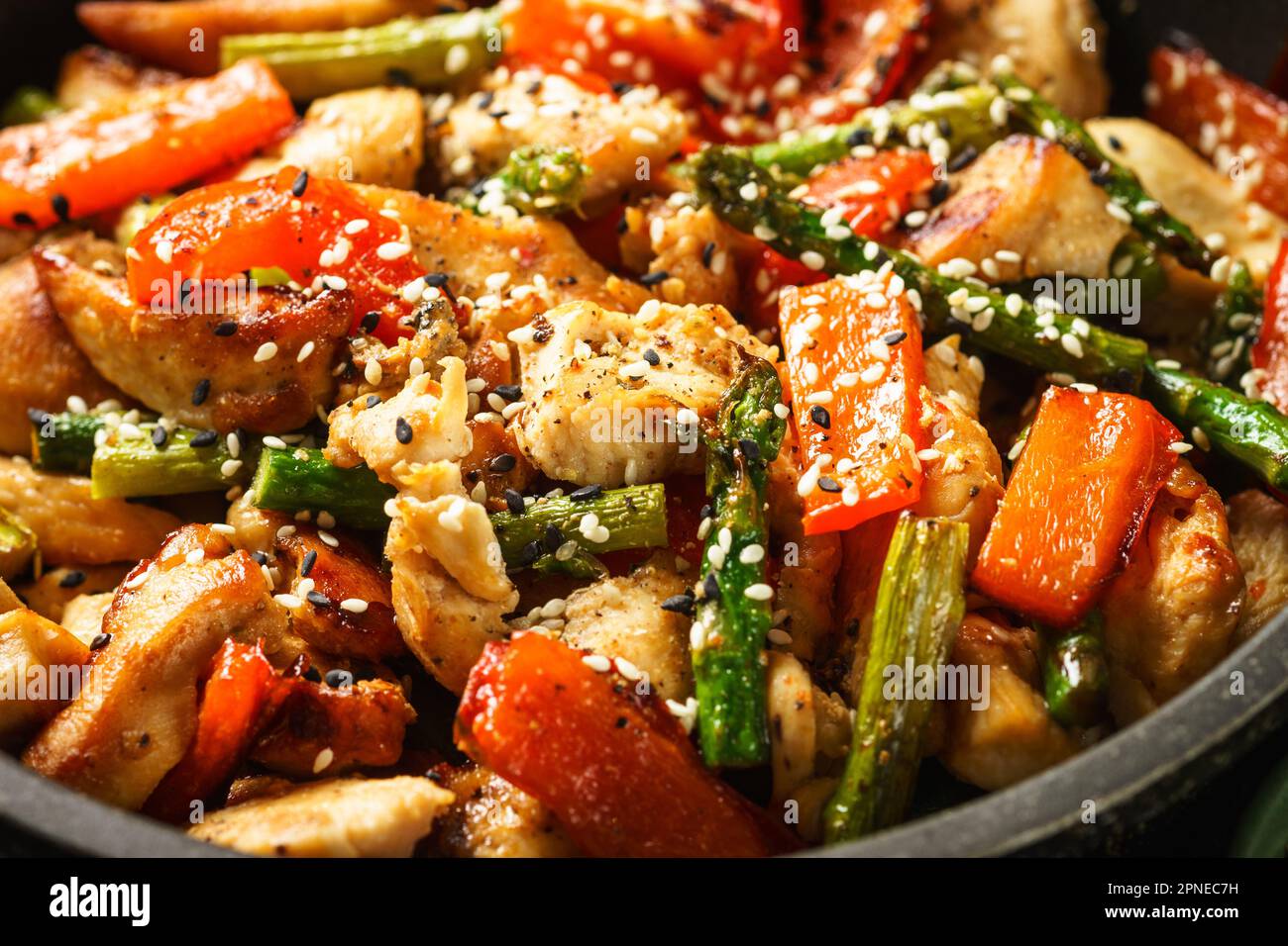 Chicken stir fry with vegetables at stone background Stock Photo - Alamy