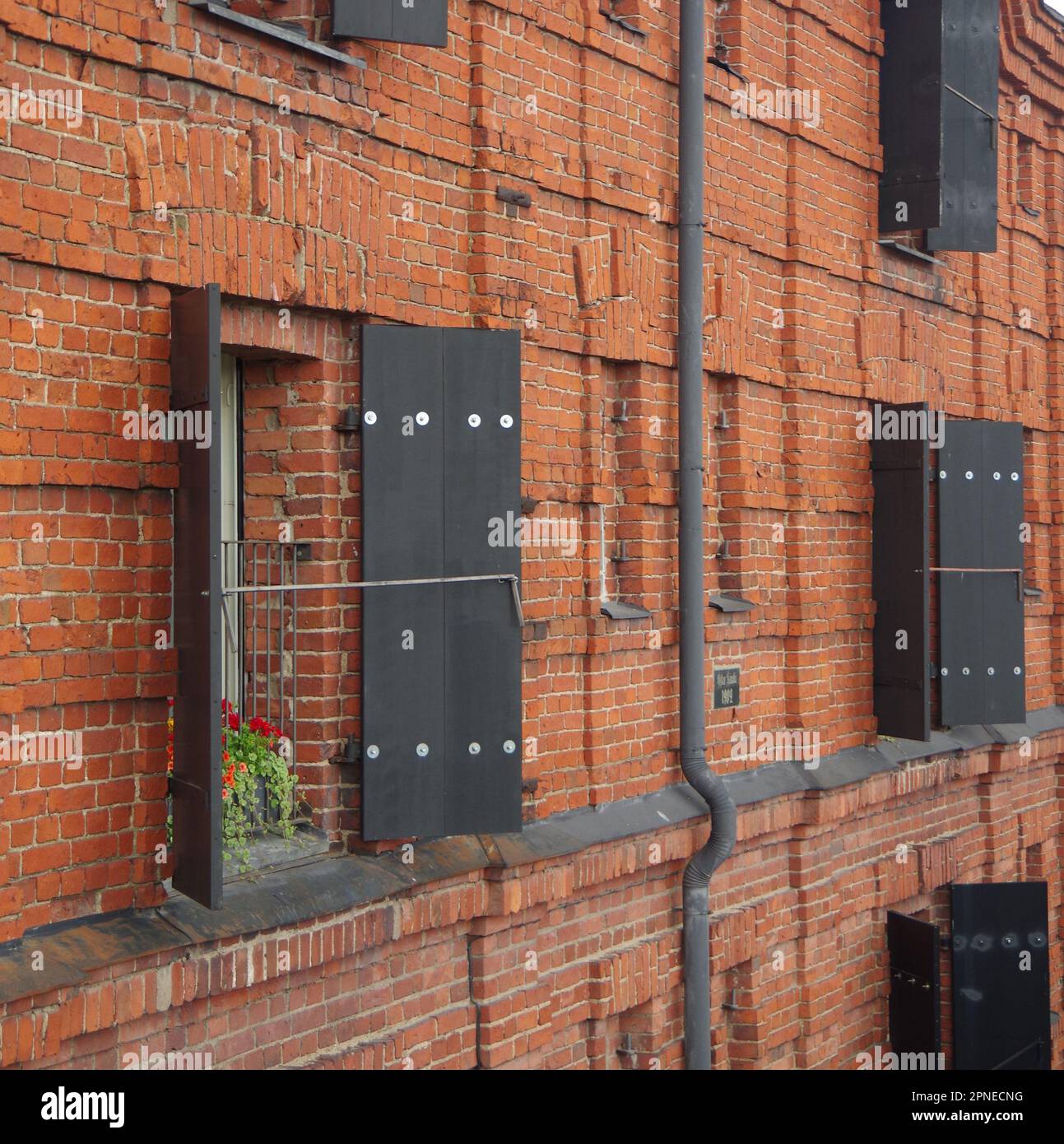 Building wall from brick with windows Stock Photo - Alamy