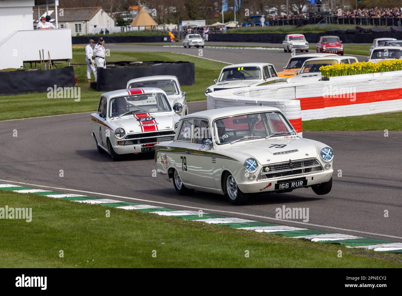 April 2023 - Lotus Cortina Mk1 racing together at the Goodwood Members ...