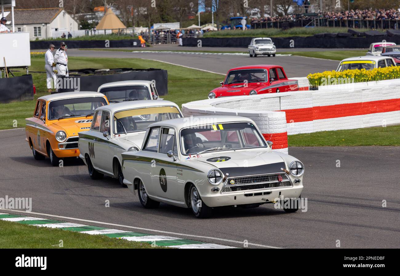 April 2023 - Lotus Cortina Mk1 racing together at the Goodwood Members ...