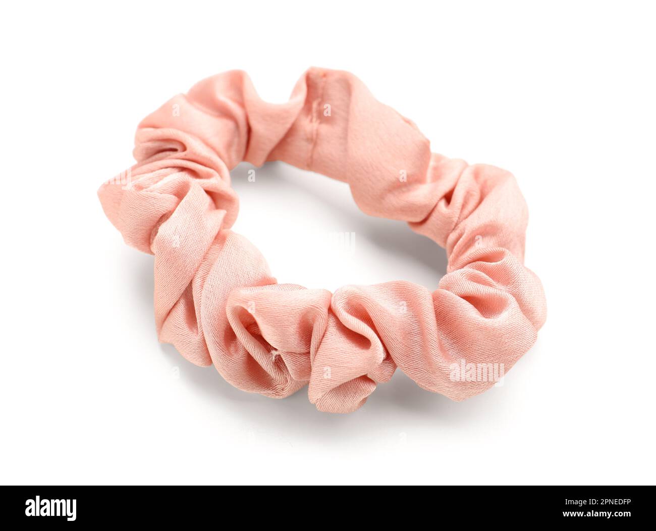 Pink silk scrunchy on white background Stock Photo - Alamy