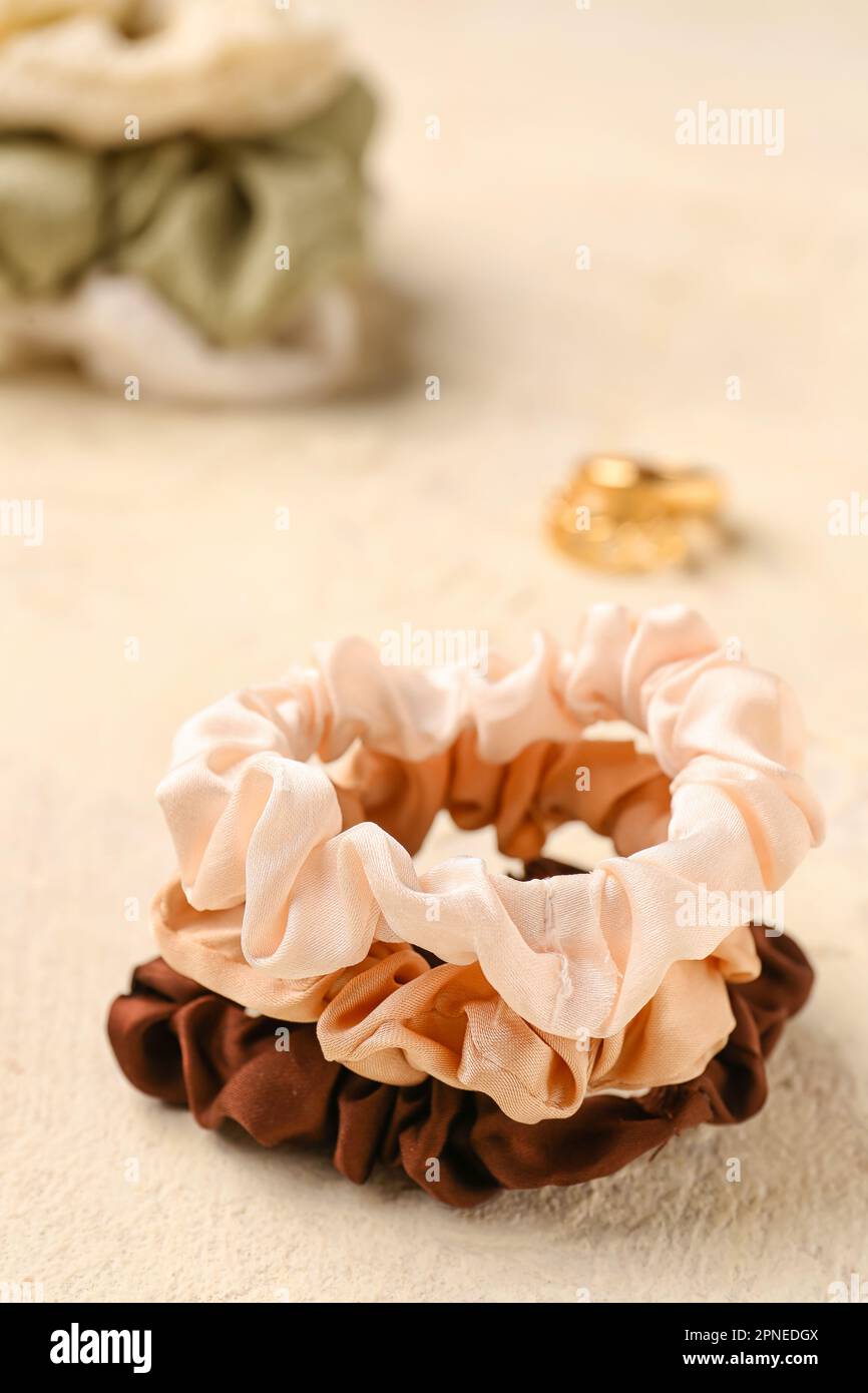 Set of scrunchies on light background Stock Photo - Alamy