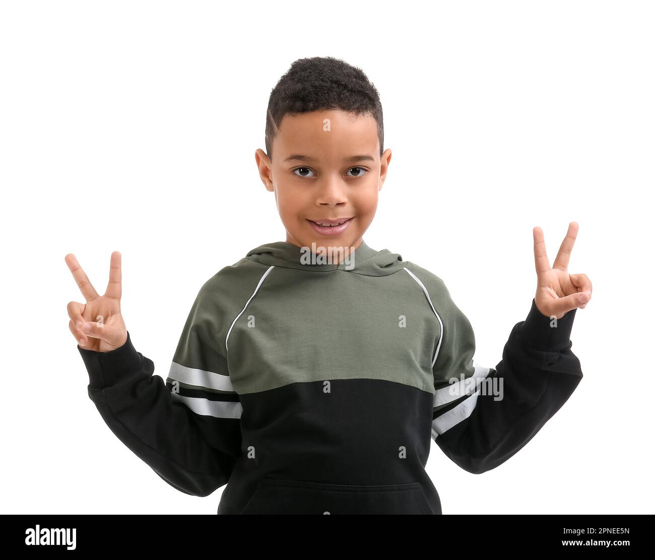 Little African-American boy showing peace gesture on white background ...