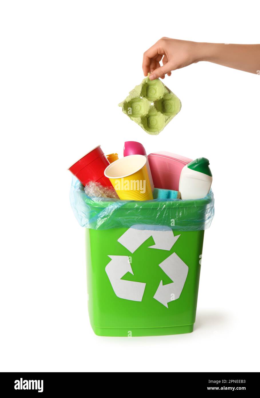 Woman throwing garbage into trash bin on white background Stock Photo ...