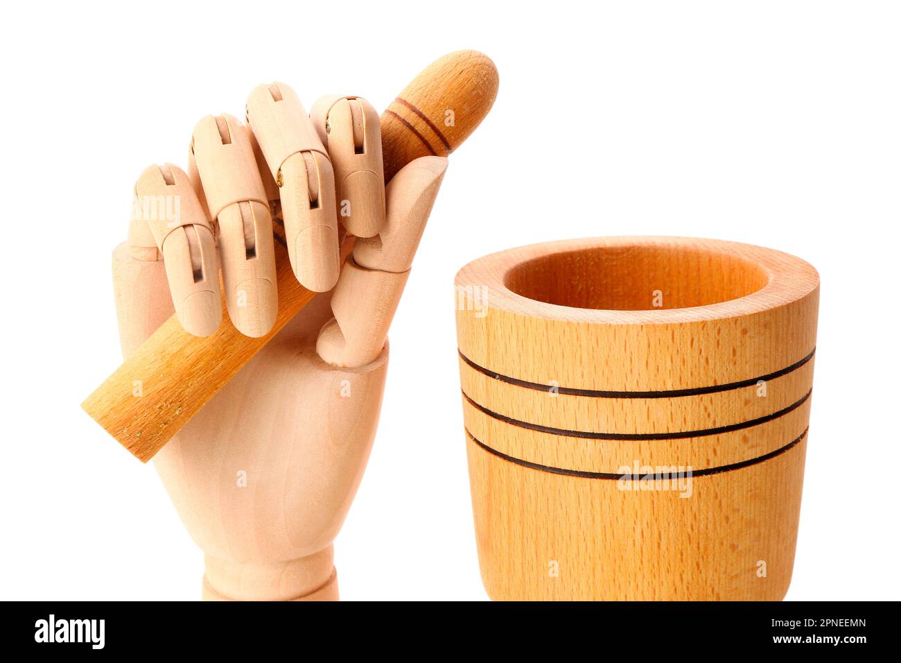 Wooden hand with mortar and pestle on white background Stock Photo - Alamy