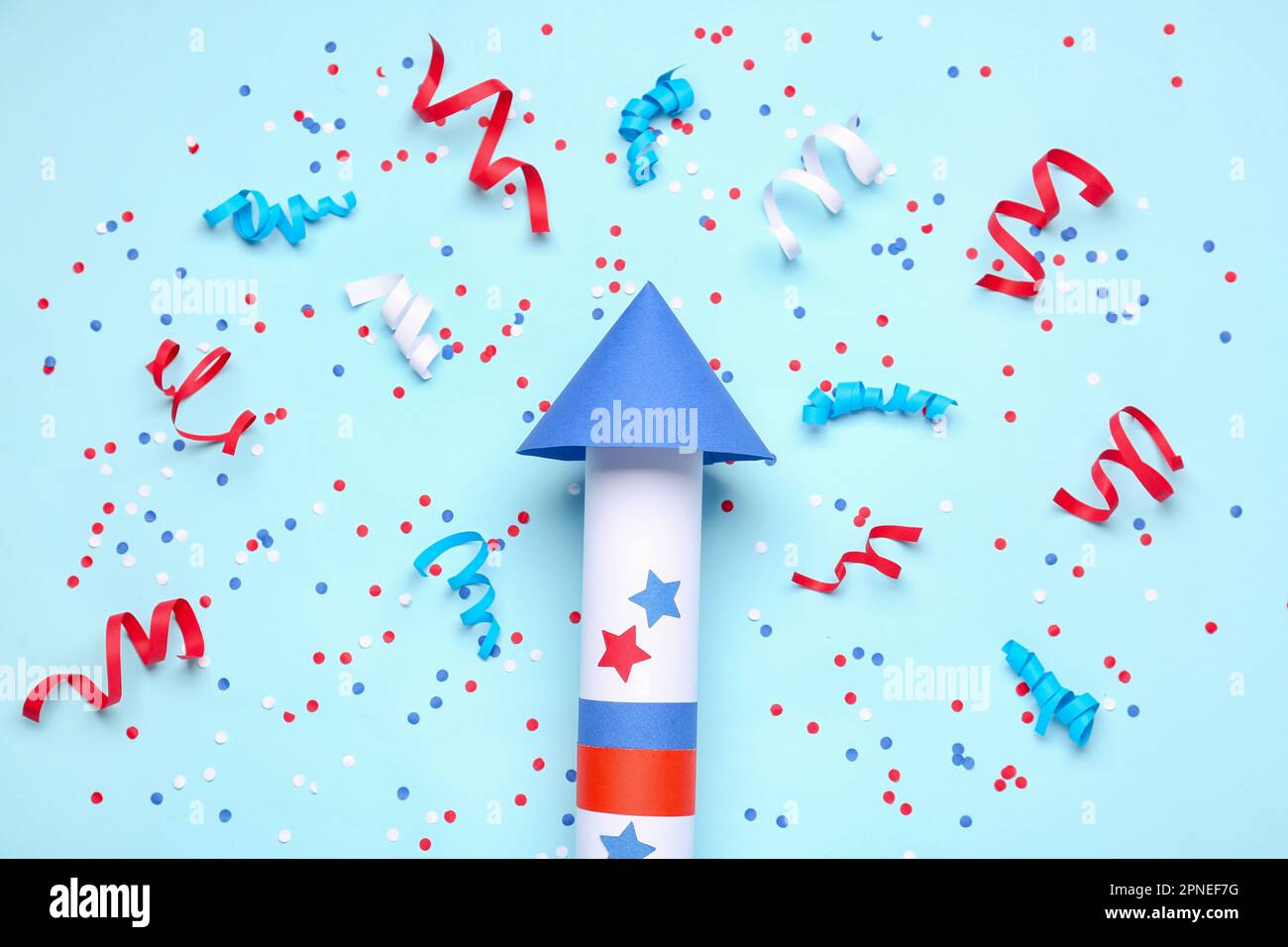 Firework rocket, confetti and serpentine for Independence Day on blue ...