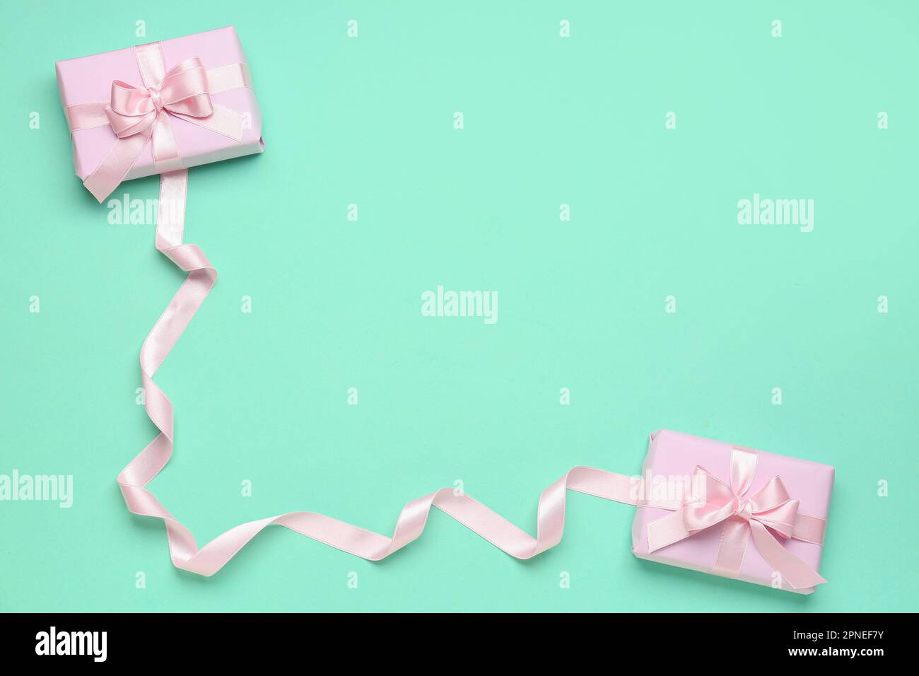 Frame made of gift boxes with bows on turquoise background Stock Photo ...