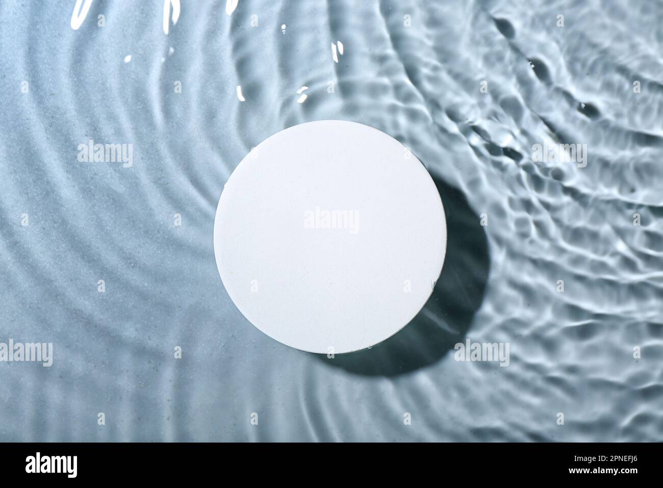 Plaster podium in water on grey background Stock Photo - Alamy