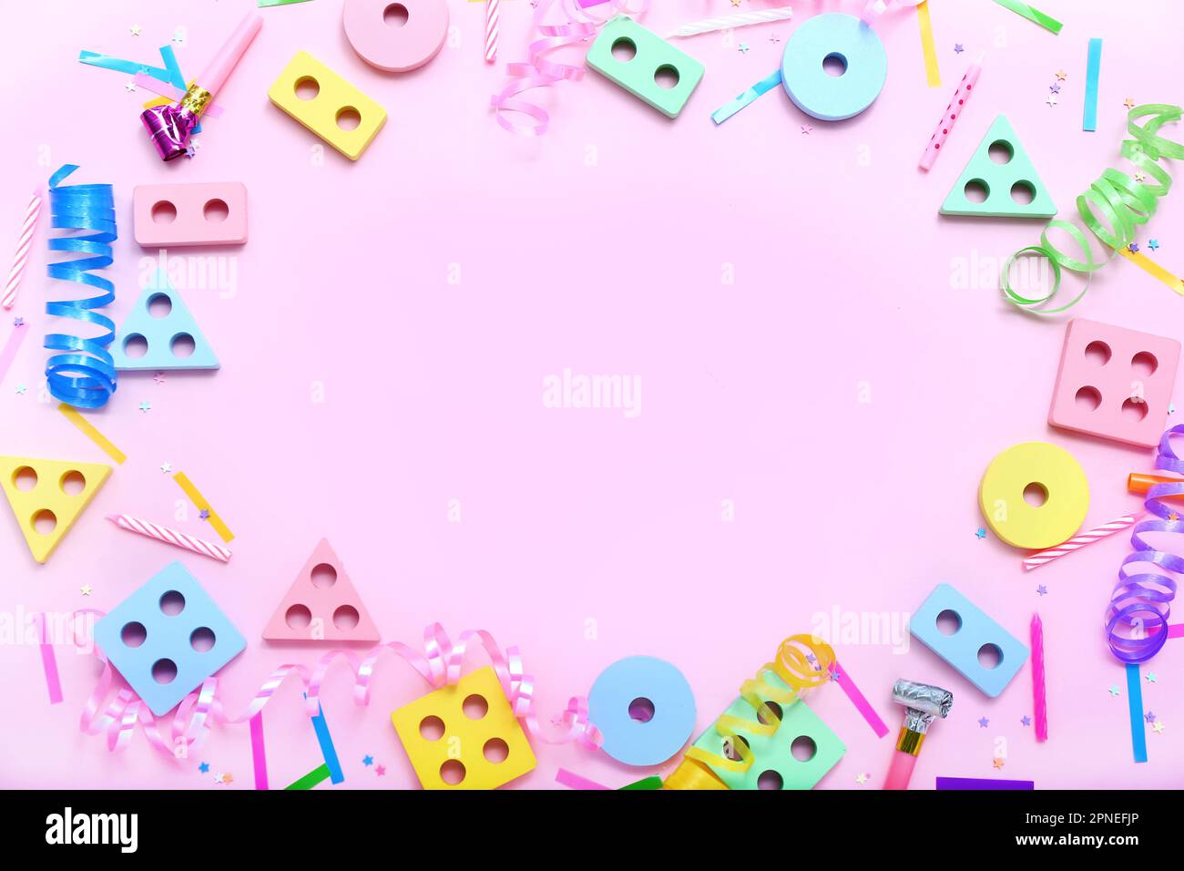 Frame made of baby blocks and confetti on pink background. Children's ...