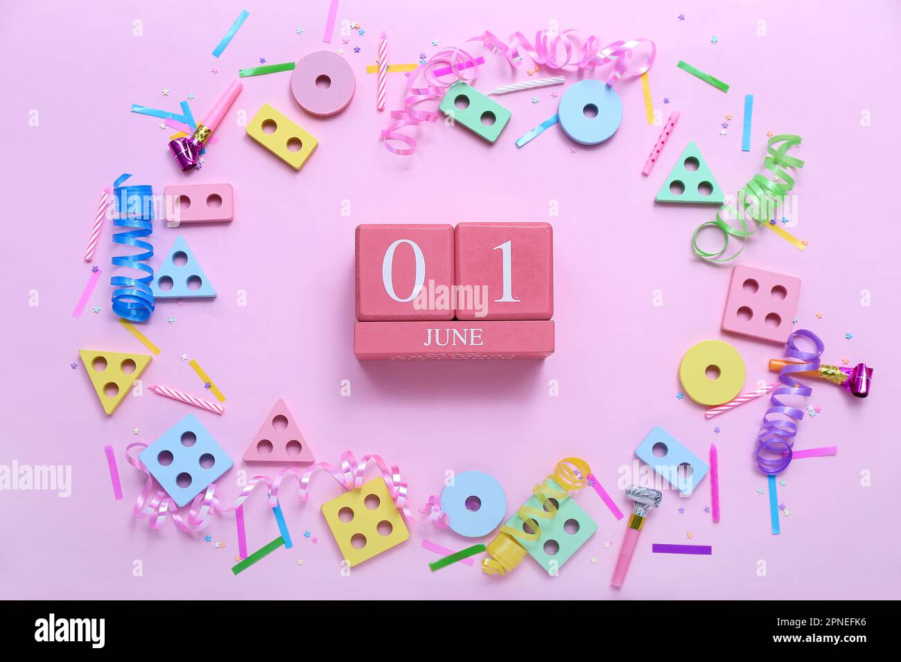 Cube calendar with date 01 JUNE, baby blocks and confetti on pink ...