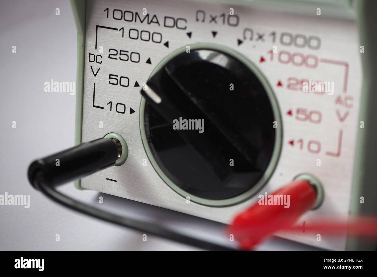Close up of a voltmeter commutator. Analog multimeter panel.DC voltage ...